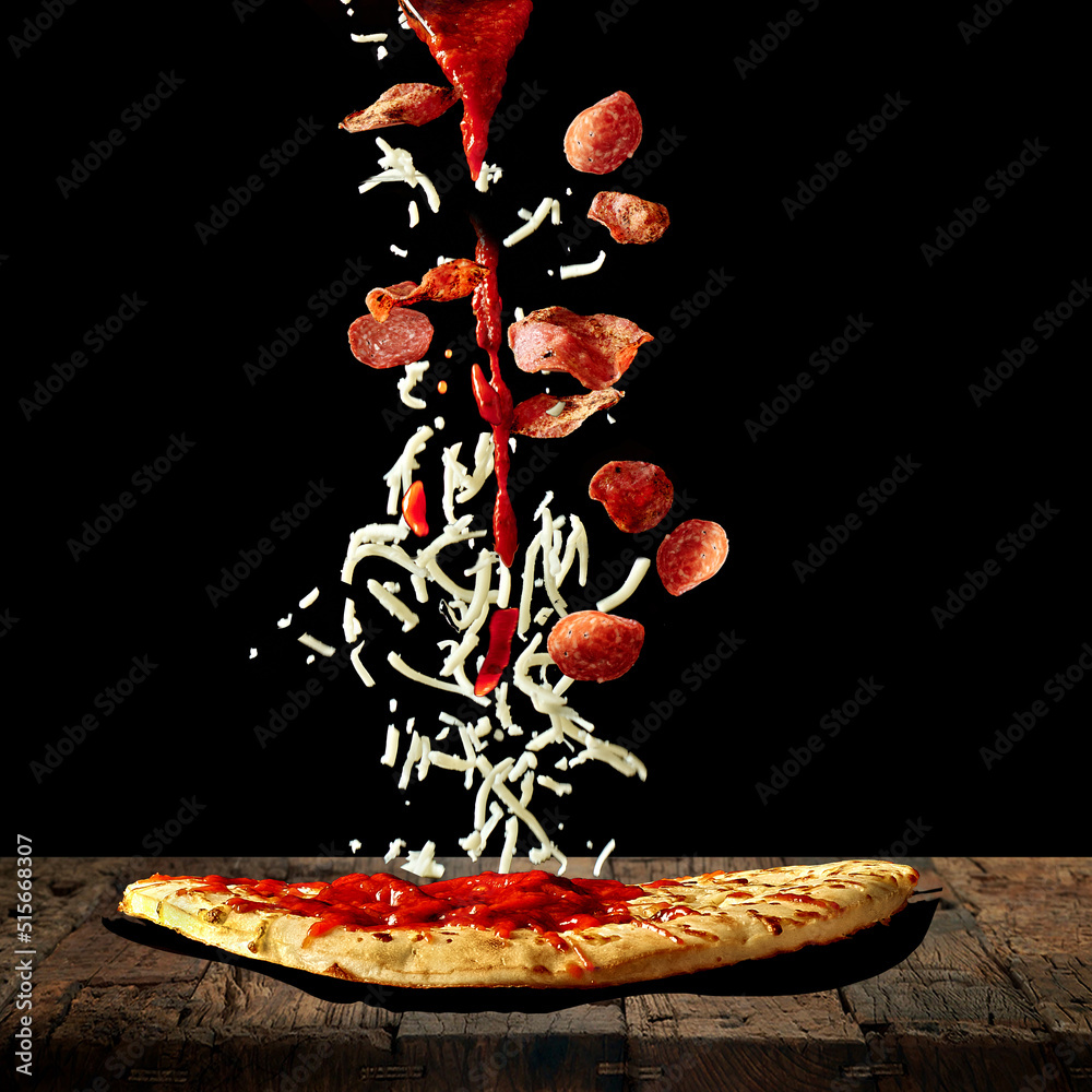 Pizza ingredients falling onto pizza bread Stock-Foto | Adobe Stock