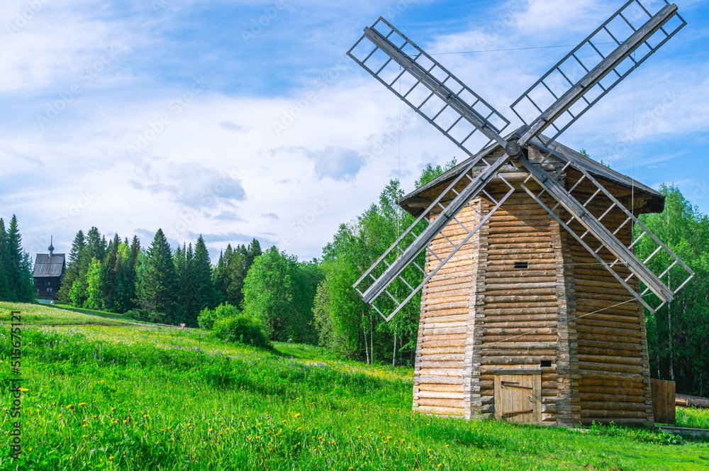 Wooden windmill for grinding flour. An old wooden windmill built in the ...