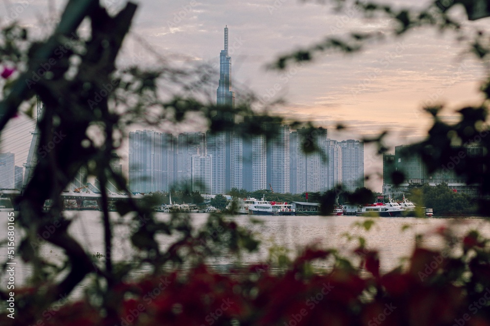 Blurred view of the Landmark 81 on the bank of Saigon River in Vietnam ...