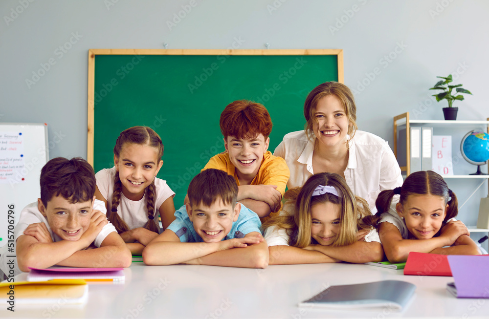 Portrait of cheerful group of elementary school students and their ...