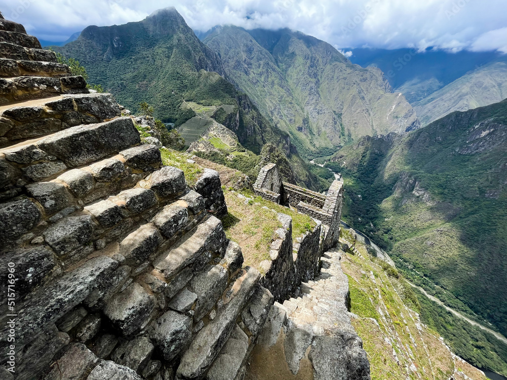 wide angle shot of stone stairway leading to the top of Huaynapicchu ...