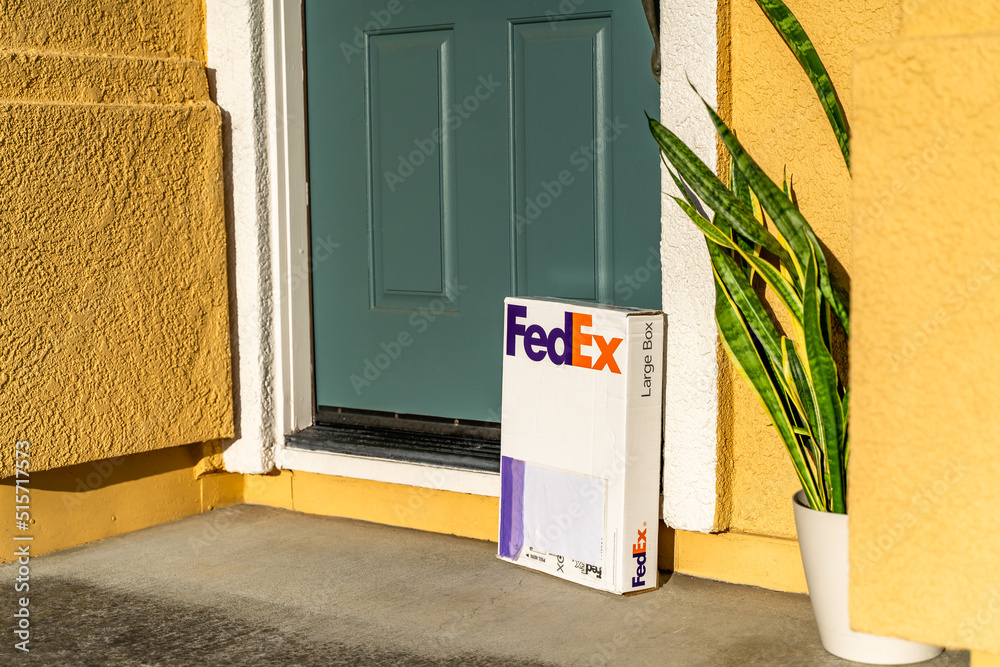 FedEx package at the front door. Delivery service. Stock Photo | Adobe ...