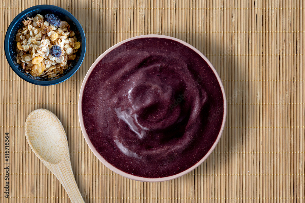 Açai bowl with granola on the side. Wooden background. Açaí Brazil ...