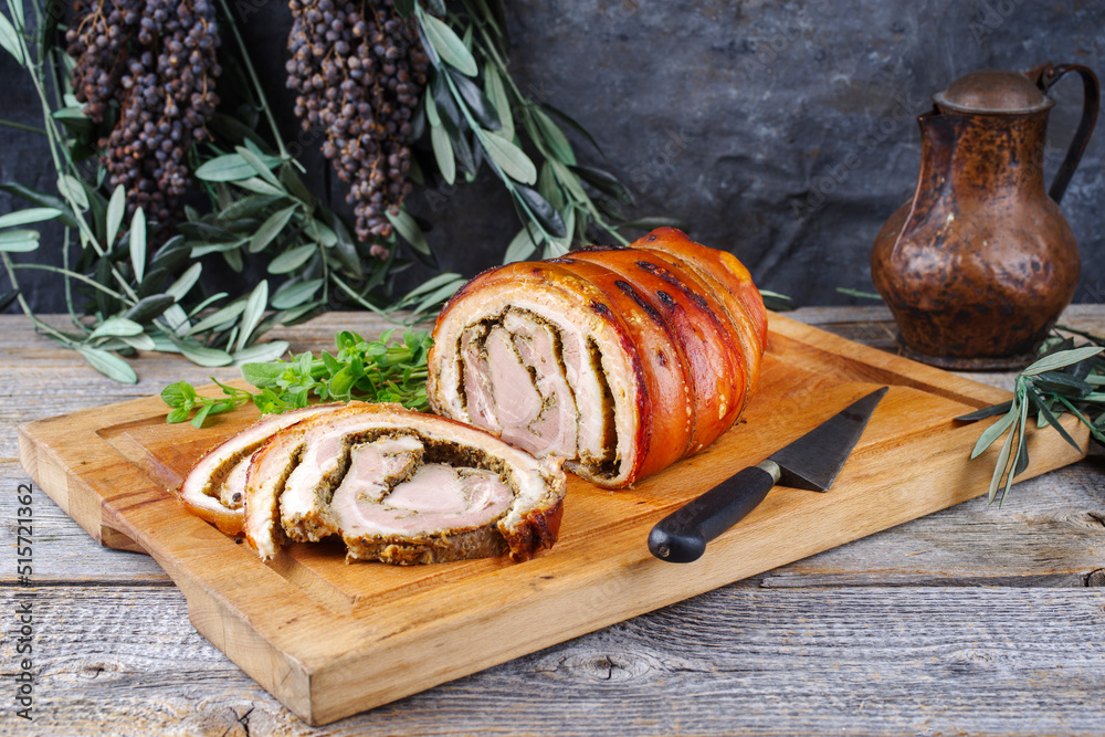 Traditional barbecue Italian porchetta pork belly roll meat as piece ...