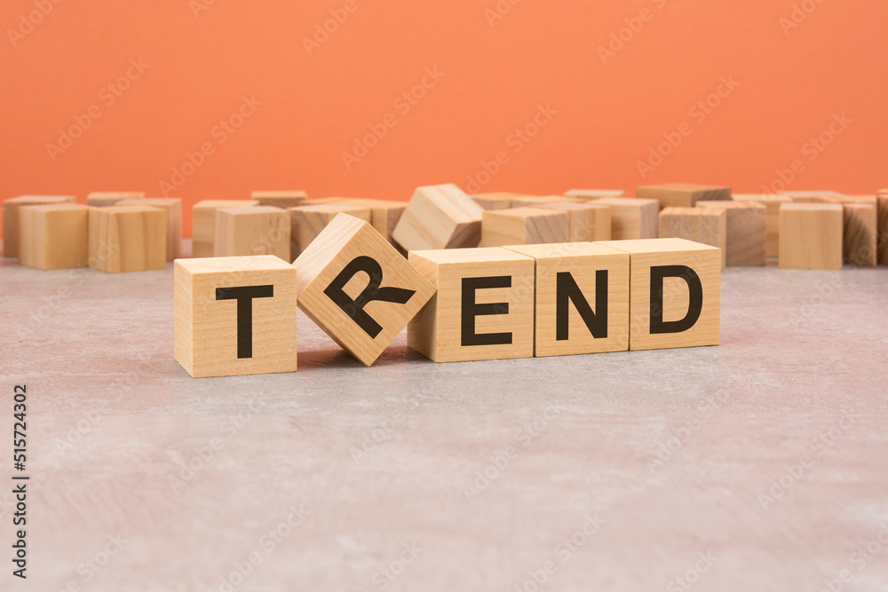 word Trend made with wood blocks. text is written in black letters ...