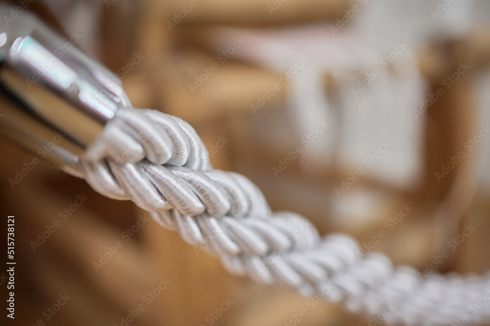 Nautical mooring line rope on the jetty. Curled mooring line. Stock ...