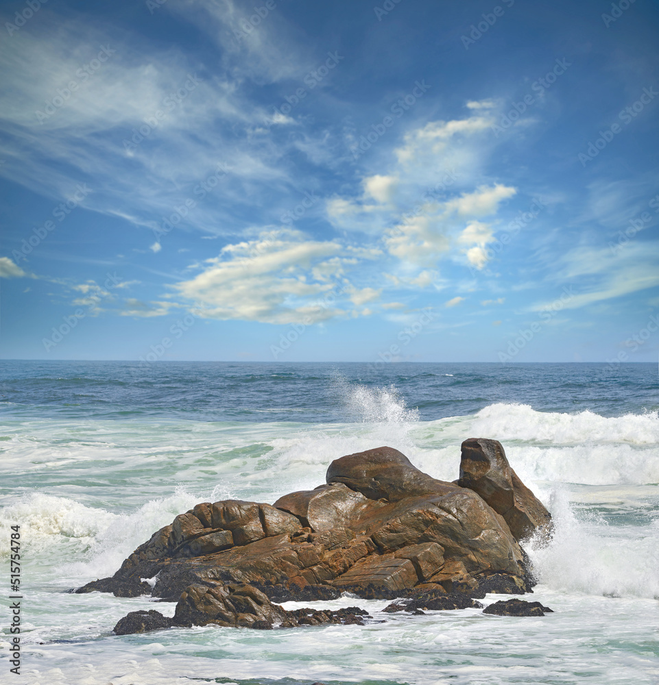 Copy space of a turbulent sea with rough tides and choppy waves from strong winds crashing onto ...