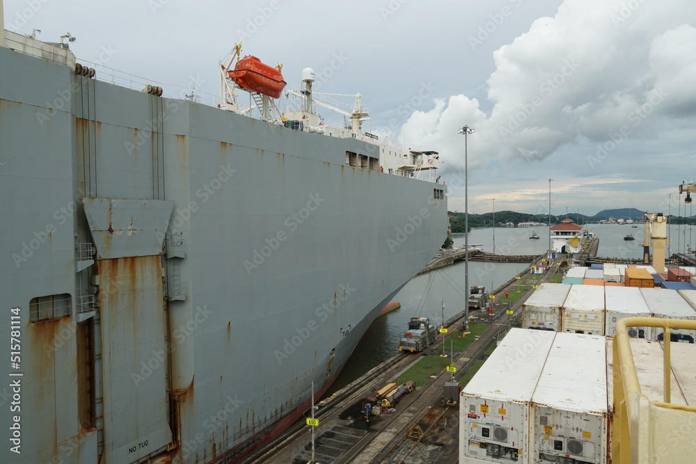 Huge grey ro ro vessel inside Pedro Miguel lock with mules during ...