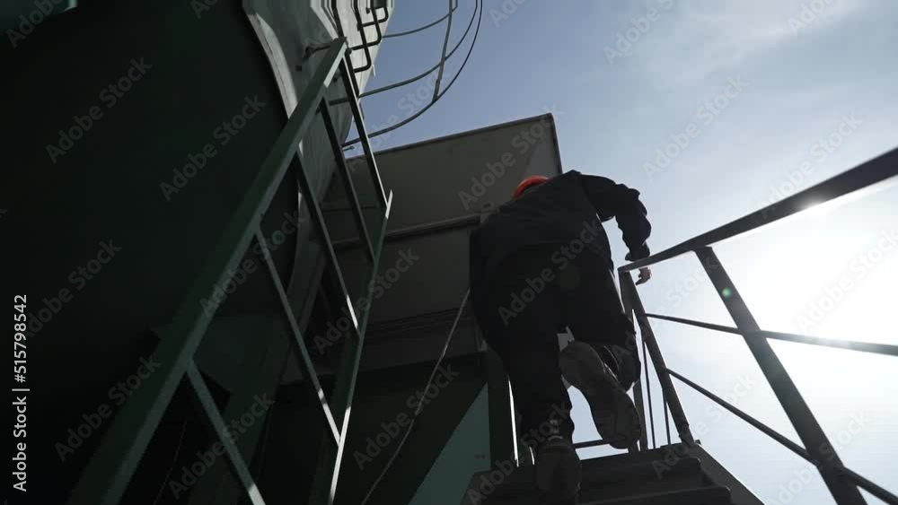 Professional caucaian civil engineer wearing safety helmet go up the ...