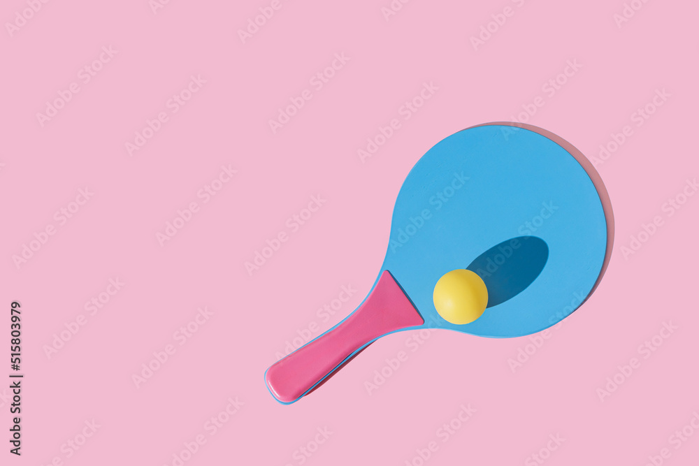 Single blue and pink colourful beach tennis paddle racket with a yellow ...