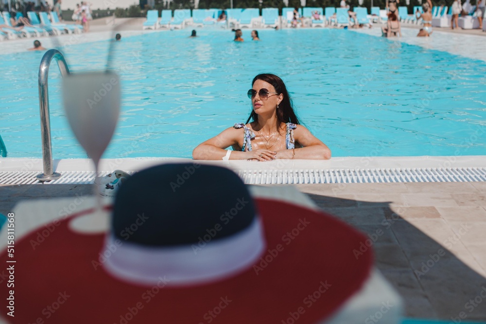 beautiful girl swimming in the pool, summer vacation by the pool, girl ...