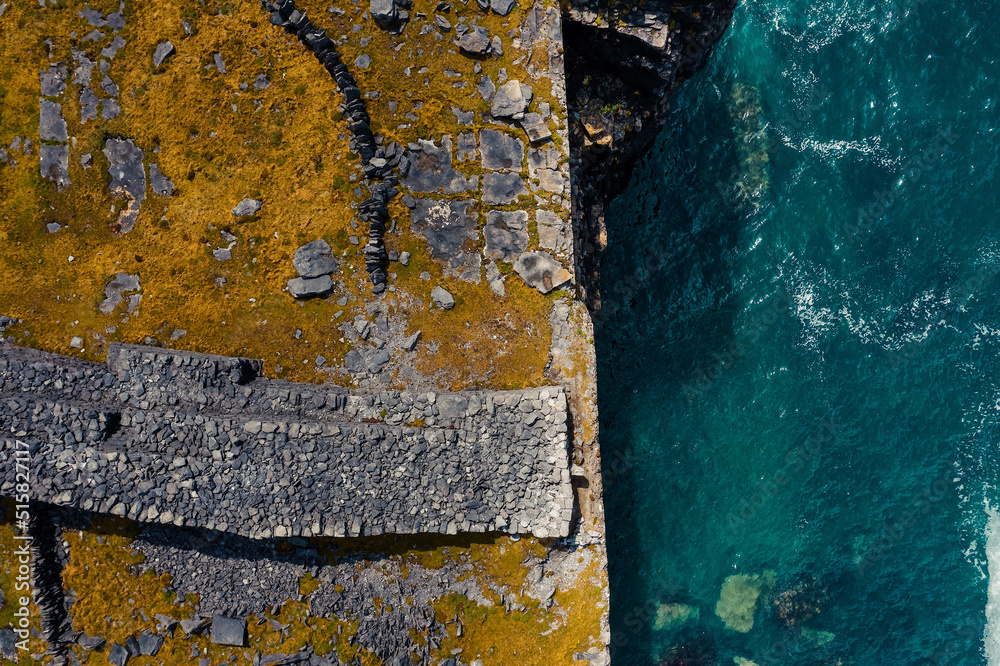 Top down view on a rough stone surface of a cliff by the ocean. Top ...