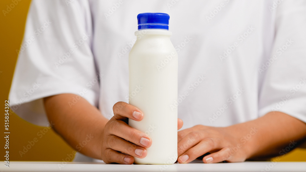 Hands and bottles. Get ready to drink milk, drink healthy milk, fresh ...