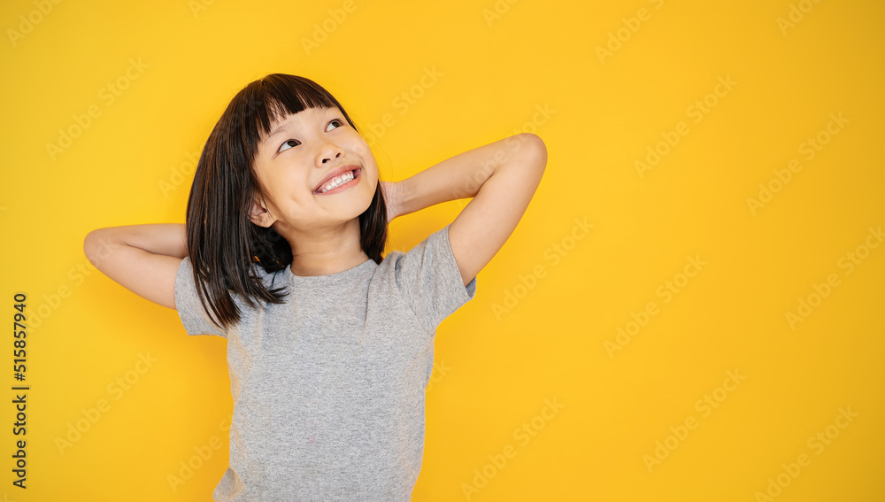 Portrait of young fun smart happy little cute asian girl look up ...