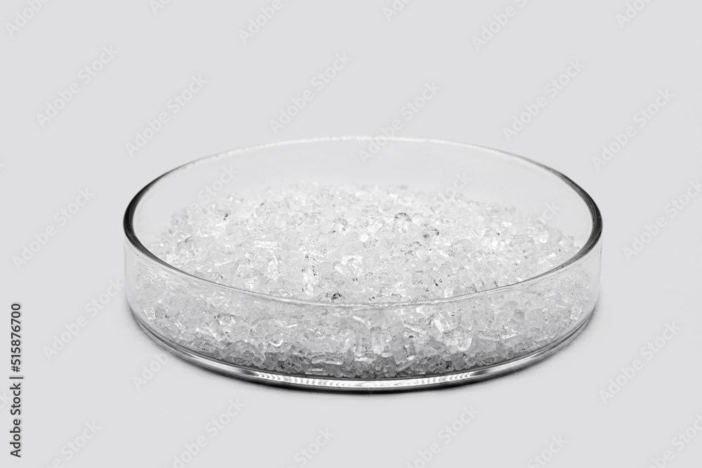 sodium chloride in petri dish, known as salt or table salt, important ...