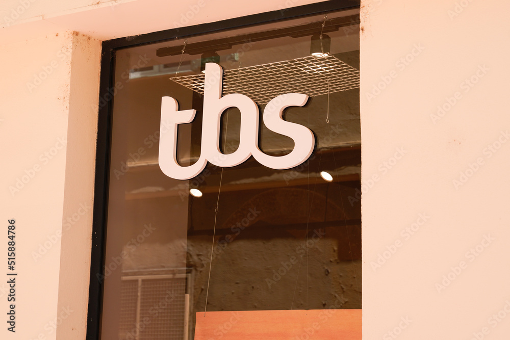 tbs boutique brand logo and sign text on windows facade entrance ...