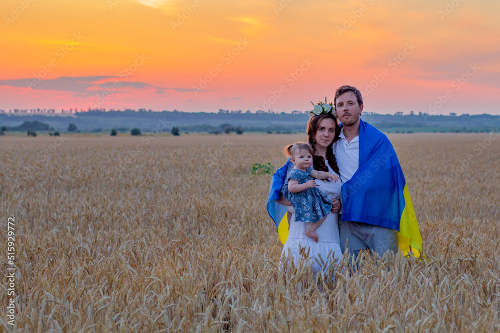 Happy smiling family in national Ukrainian embroidered shirts hold ...