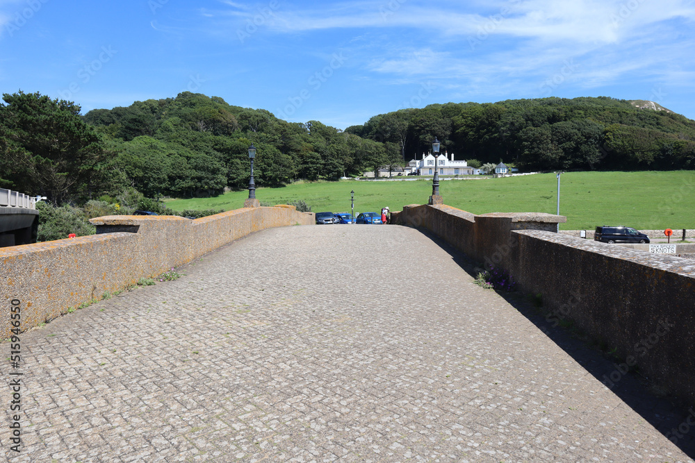 The old road bridge across the River Axe at Axmouth. It was replaced in ...