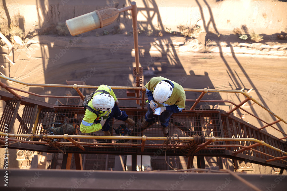 Tope picture of construction miner workers conducting self risk ...