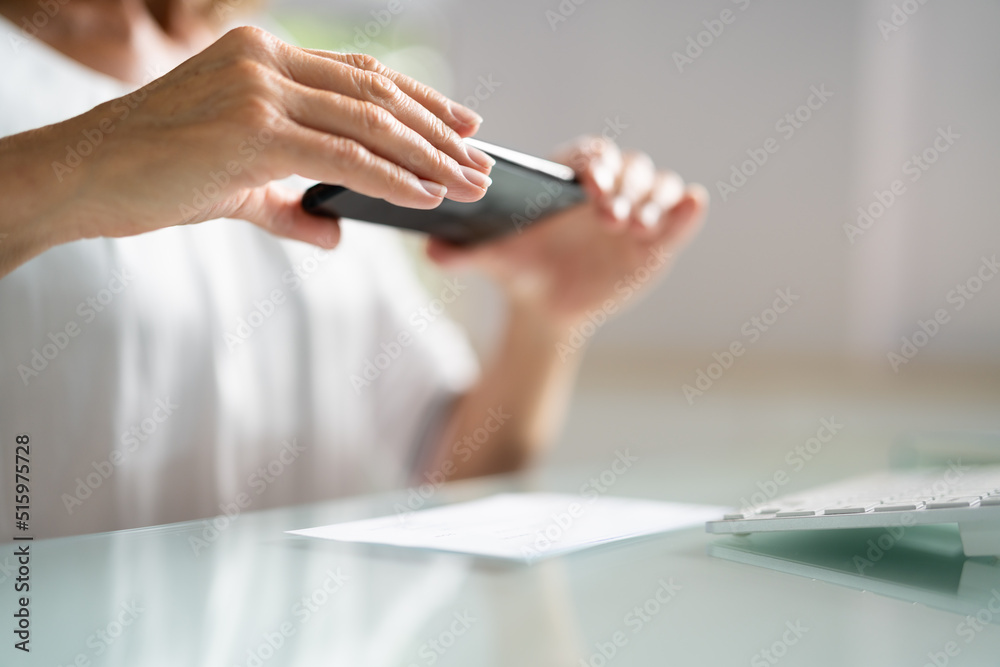 Remote Cheque Deposit Using Mobile Phone Stock Photo | Adobe Stock