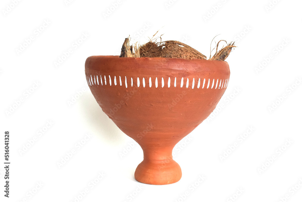 Durga puja dhunuchi with coconut husk front view with isolated white ...