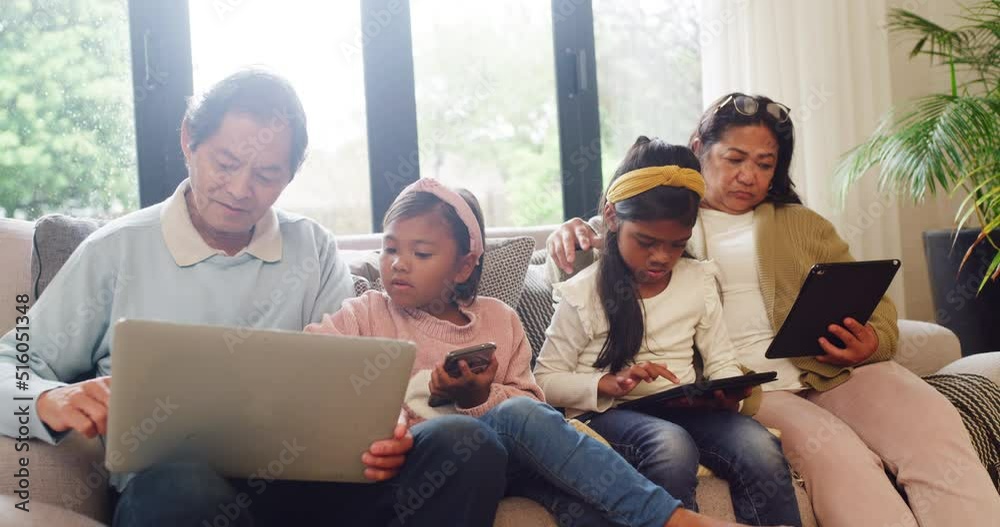 Asian children and grandparents addicted to modern technology while ...