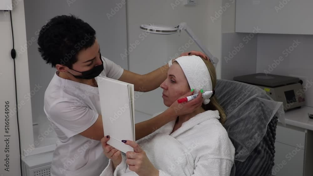 Drawing lines on the patient's face with a marker, before the facelift ...