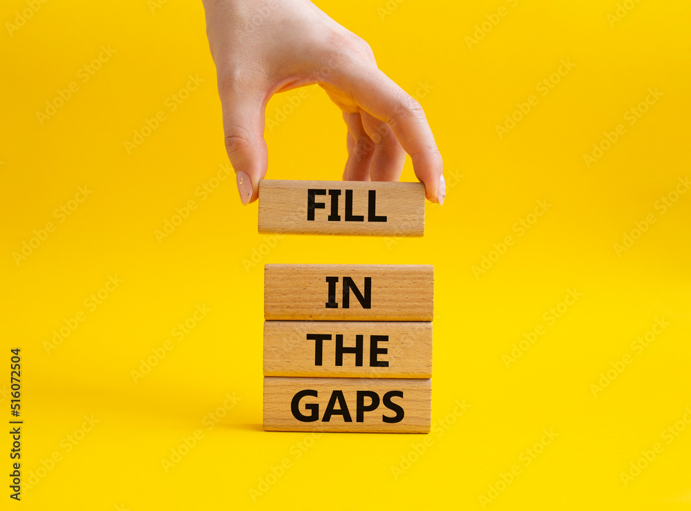 Fill in the gaps symbol. Concept words fill in the gaps on wooden blocks. Beautiful yellow ...