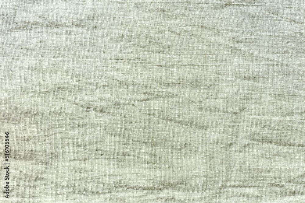light beige wrinkled linen fabric background. natural cloth texture ...