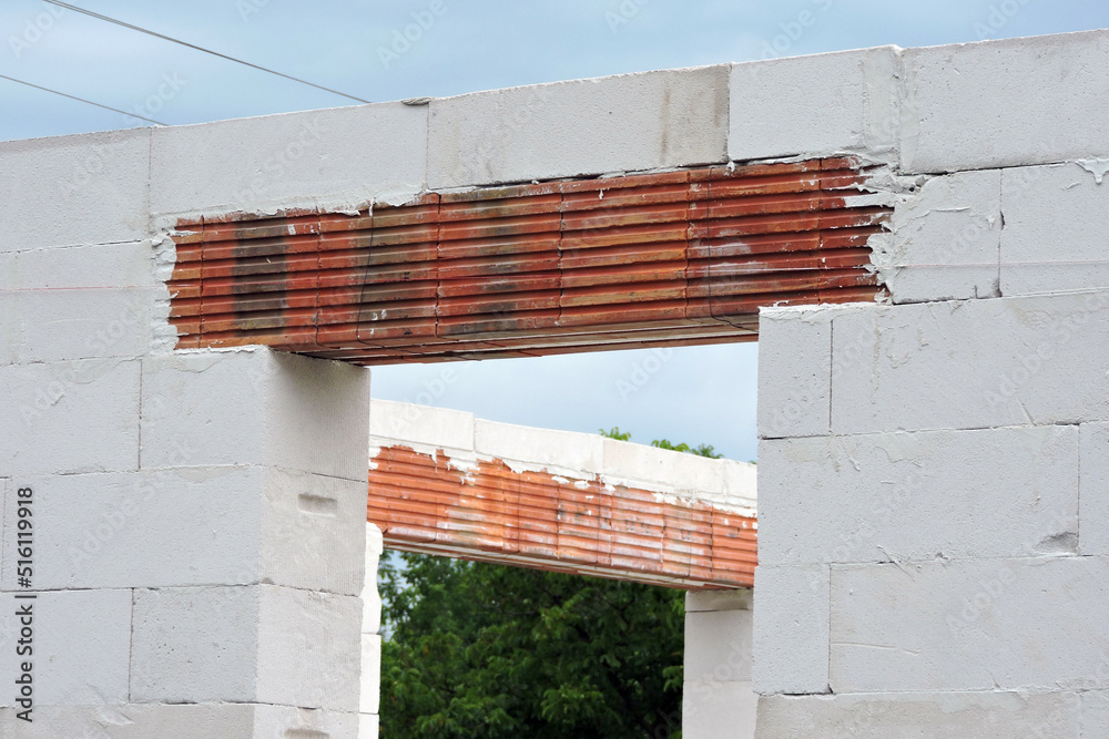 Reinforced brick lintels, rough window openings and walls made of ...