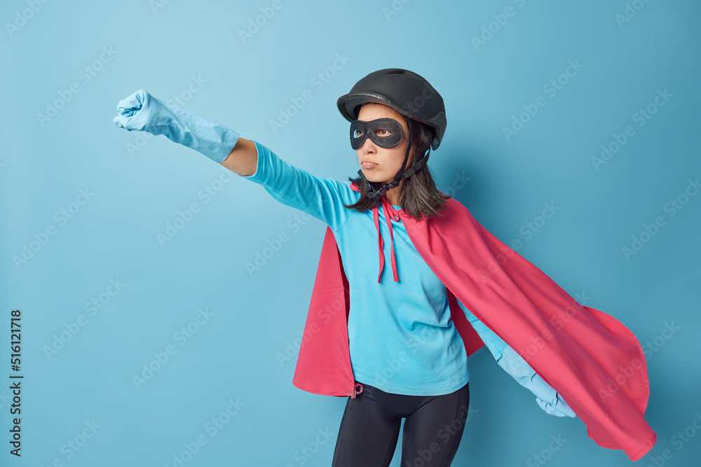 Brave young superhero woman with dark hair being justice defender makes ...
