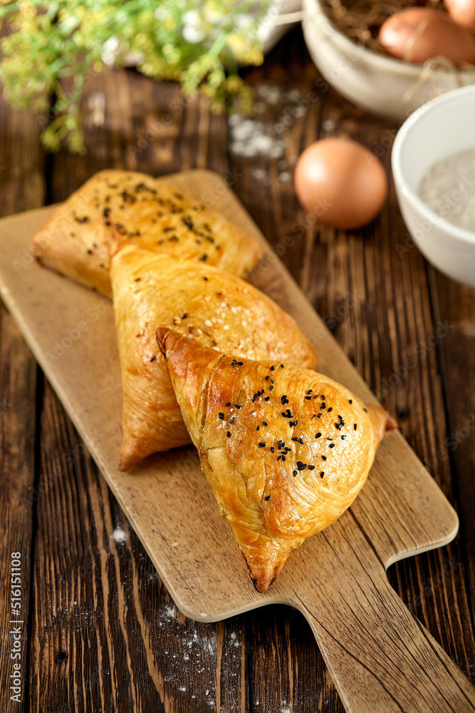 aditional uzbek pastry - samsa with meat. Uzbek pies with meat and puff ...