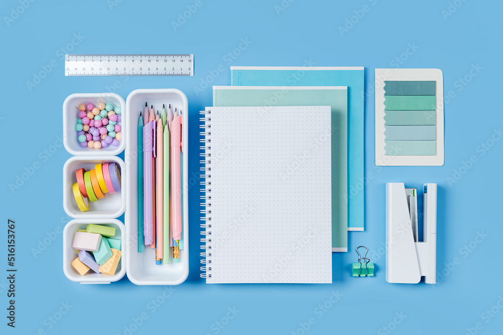Notebooks and stylish school stationery is arranged in organizers ...