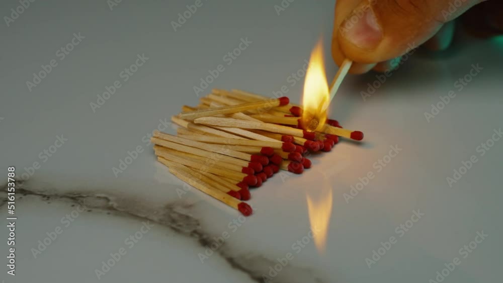 Pile of new wooden matches with red sulfur. Fire sticks. Person brings ...