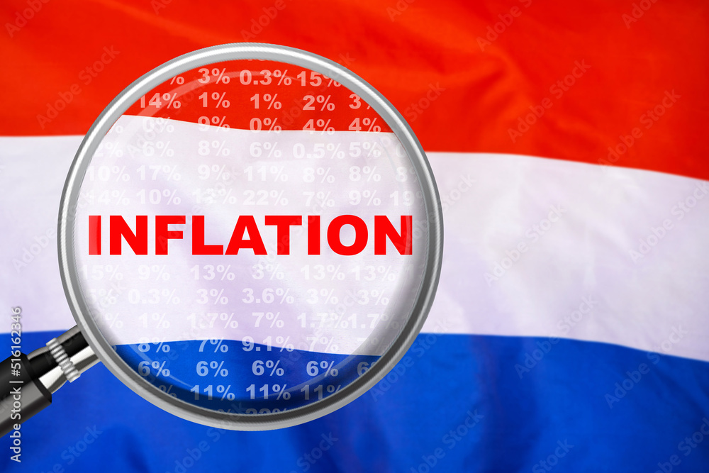 Magnifying glass focused on the word inflation on Netherland flag ...