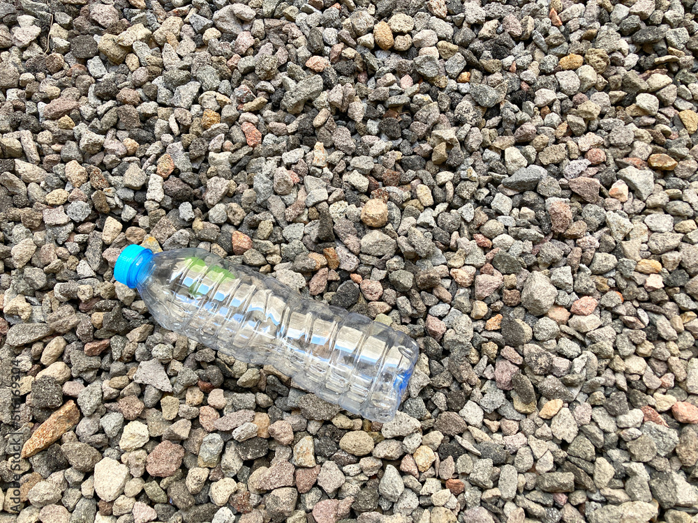 mineral water bottle on rocks background. thirst refresher after ...
