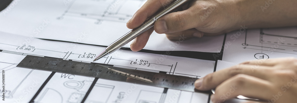 Engineer and Architect concept, Man uses a ruler to measure the floor ...