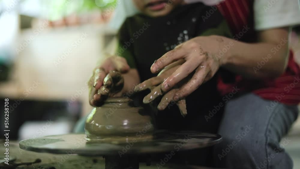 Happy family moment Mother and little boy crafting pottery clay ...