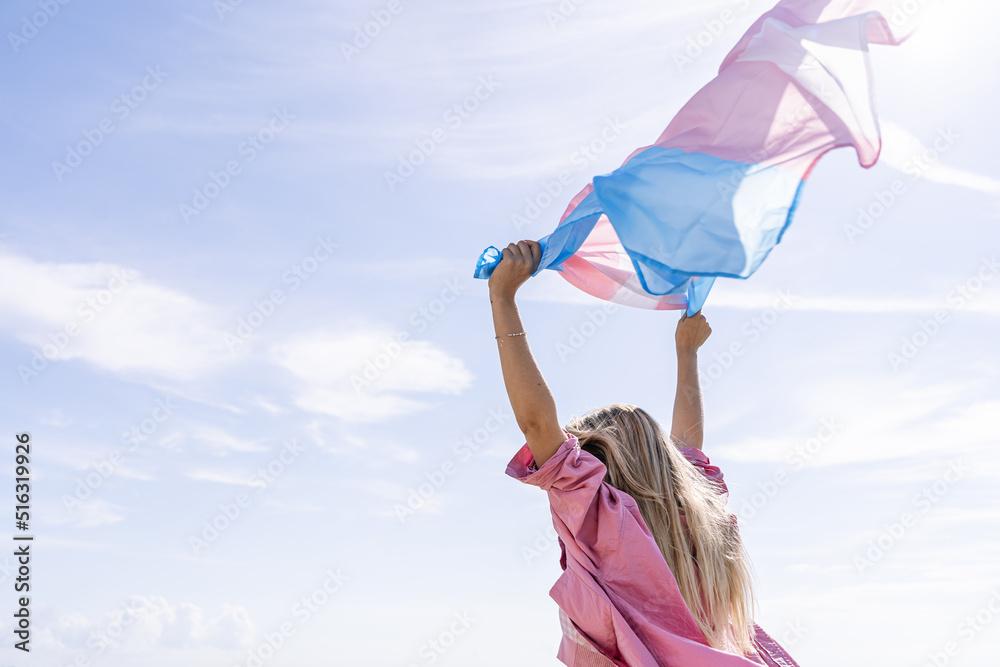 Young woman with trans flag Stock-Foto | Adobe Stock