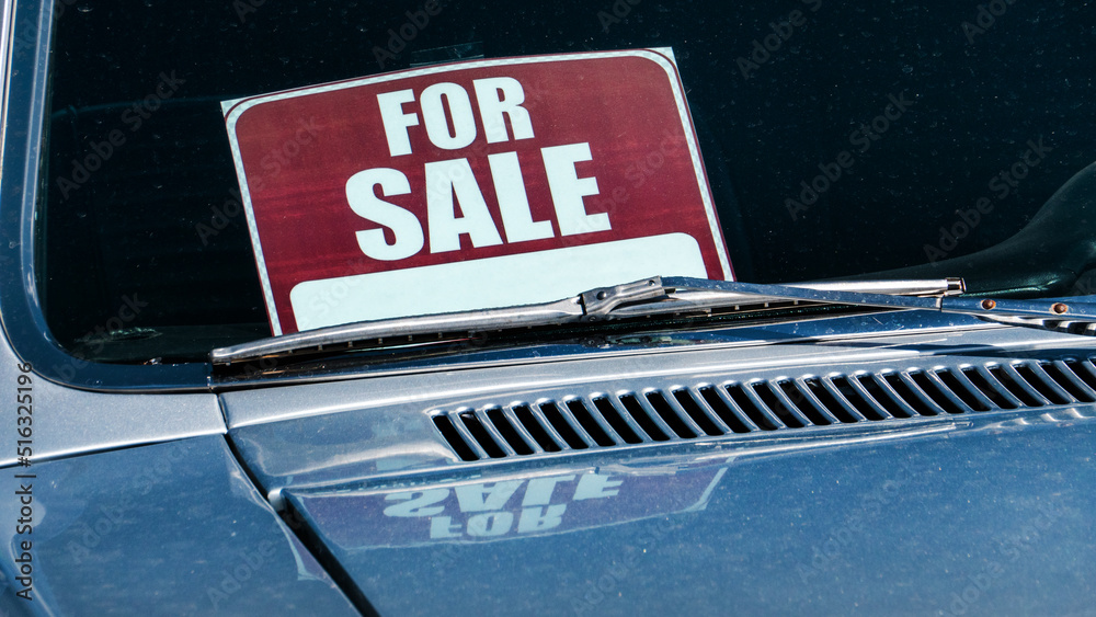 A "FOR SALE" sign behind the windshield on the old car Stock Photo ...