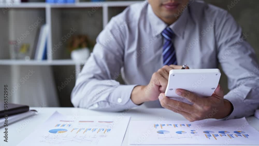 businessman financial specialist is working with calculator and ...