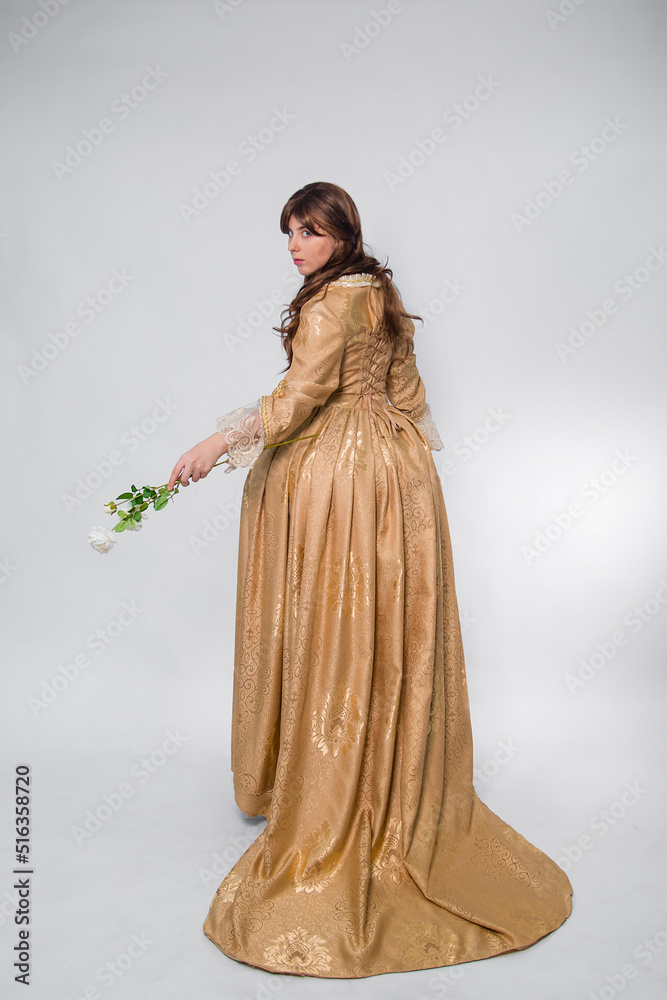 Full length portrait of a woman in a gold dress in the style of the ...
