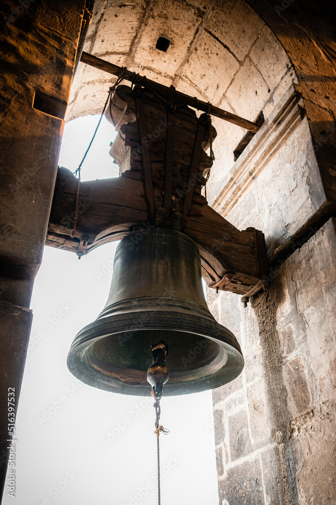 High contrast low, angle backlit photograph in the vertical format of ...