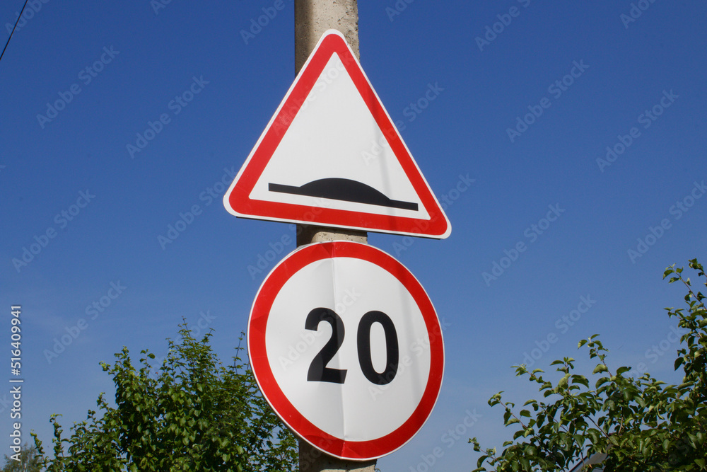 Road sign "Speed bumps" (also called traffic thresholds, speed breakers ...