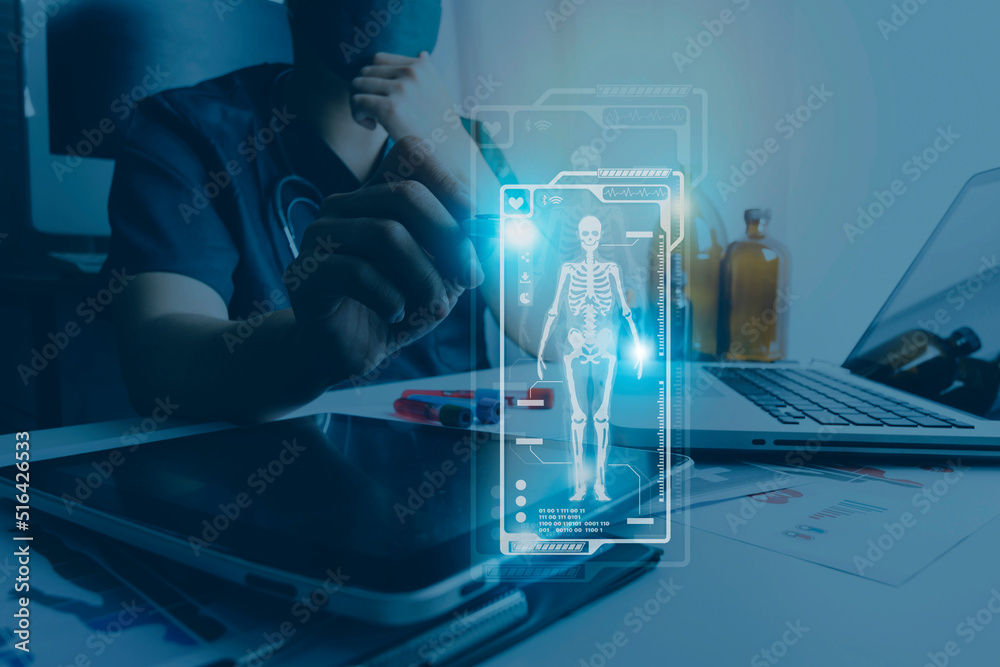 Medicine doctor hand working on a patients x-ray scans digital ...