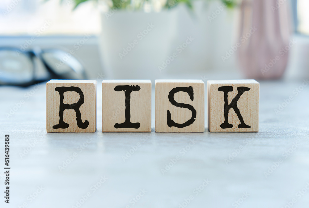 Wooden cubes with the word risk. Risk taking, risk management or ...