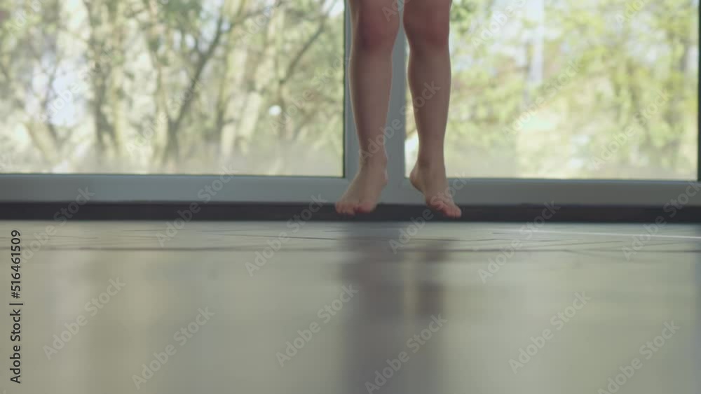barefoot legs jumping child on floor indoors, valgus heels flat-feet ...