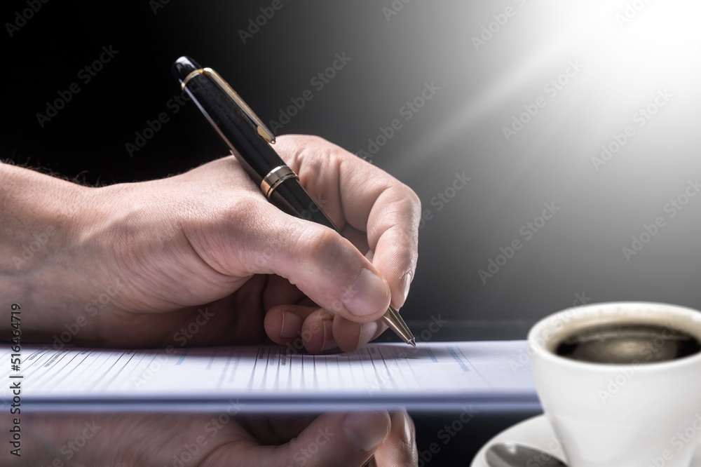 Hand using writing pen filling in business company personal information ...