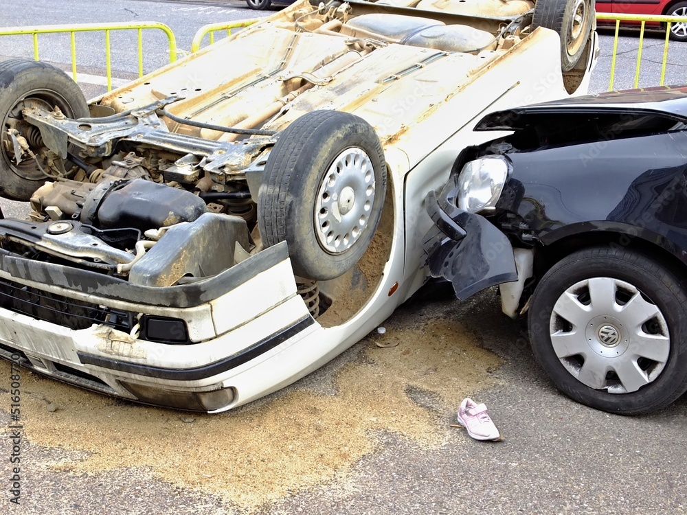 Serious car accident involving a white and black car Stock Photo ...