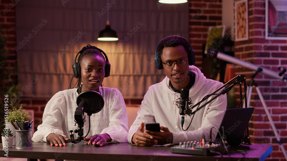 African american influencer couple streaming live dual vlog talking ...